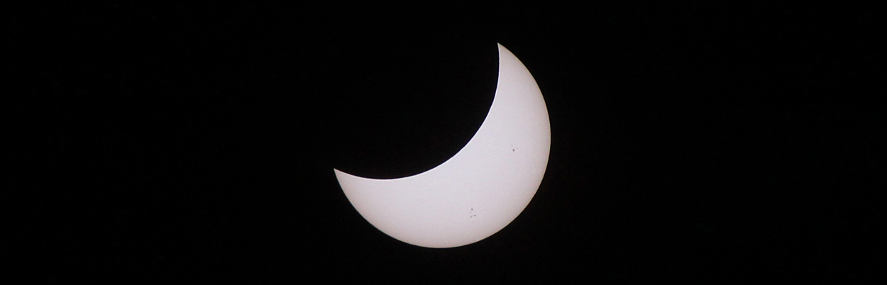 partial eclipse image by Rick Fienberg 1250 400 - Lewis Ginter ...